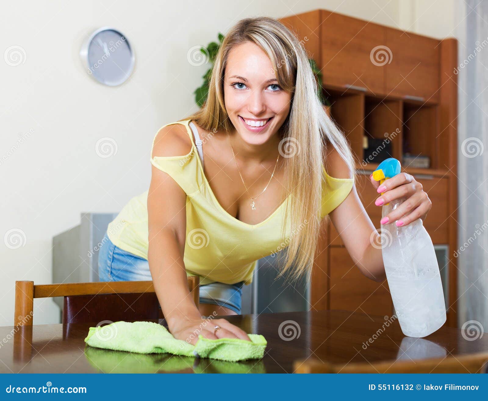 Young Smiling Woman Dusting Table Stock Photo - Image of housewife ...
