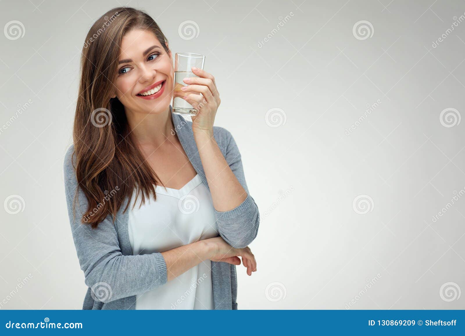 Young Smiling Woman Holding Water Glass. Isolated Studio Portrait Stock ... Young Smiling Woman Holding Water Glass. Isolated Studio Portrait Stock ...