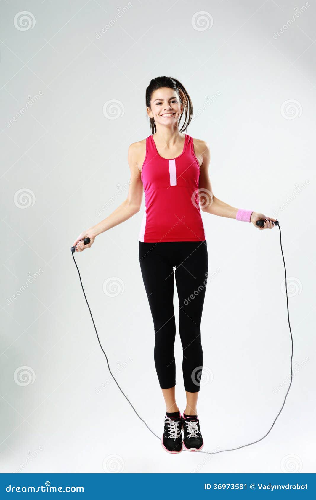 Young Smiling Woman Jumping Rope Stock Image - Image of caucasian ...
