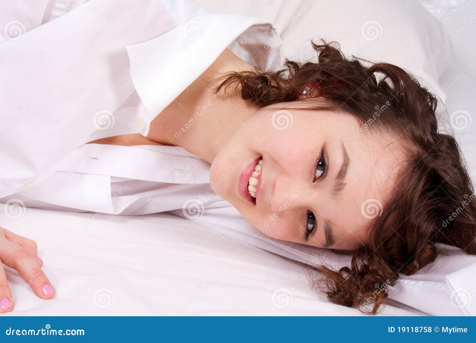 Young Smiling Woman Lying on the White Bed Stock Photo - Image of bliss ...