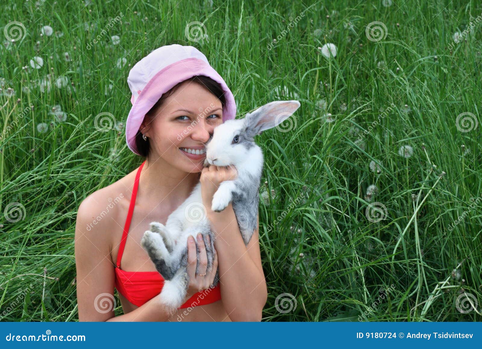 Young Smiling Woman and Rabbit Stock Photo - Image of dandelion ...