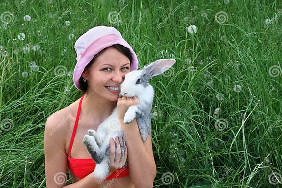Young Smiling Woman and Rabbit Stock Photo - Image of dandelion ...