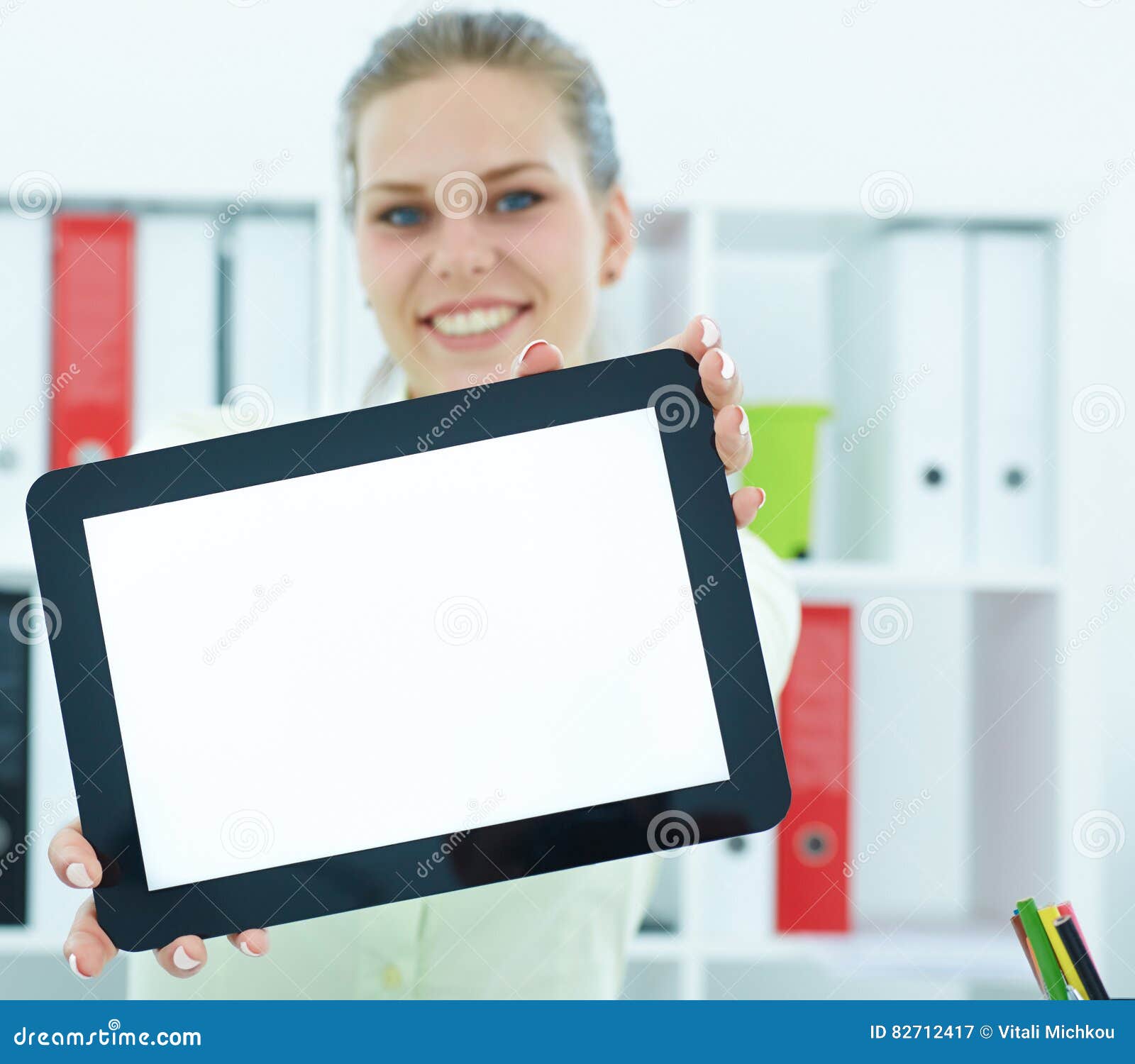 Young Smiling Woman Showing Blank Tablet Computer Screen in Office ...