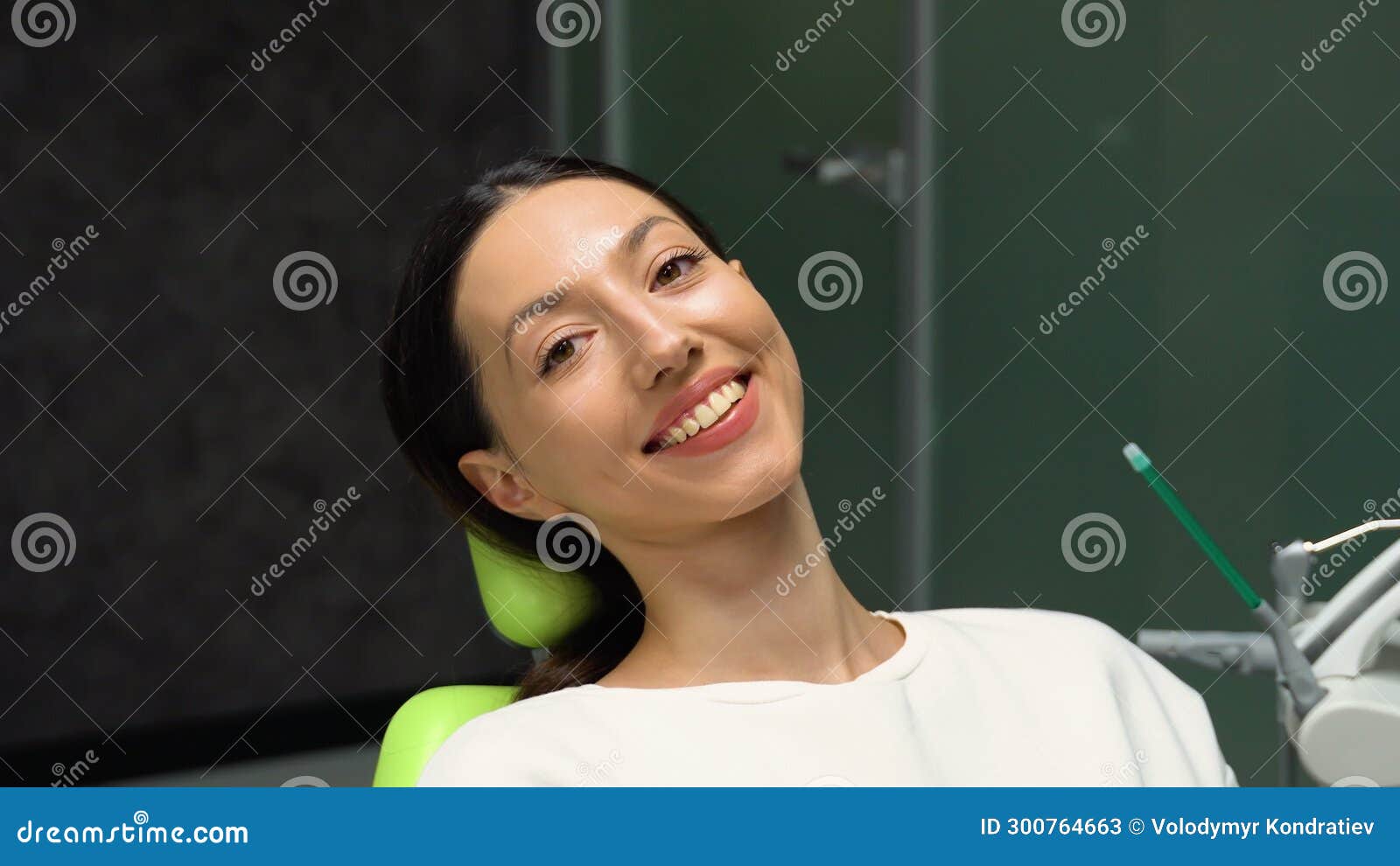 Young Smiling Woman Sitting On Chair At Dentist Office Dental Care