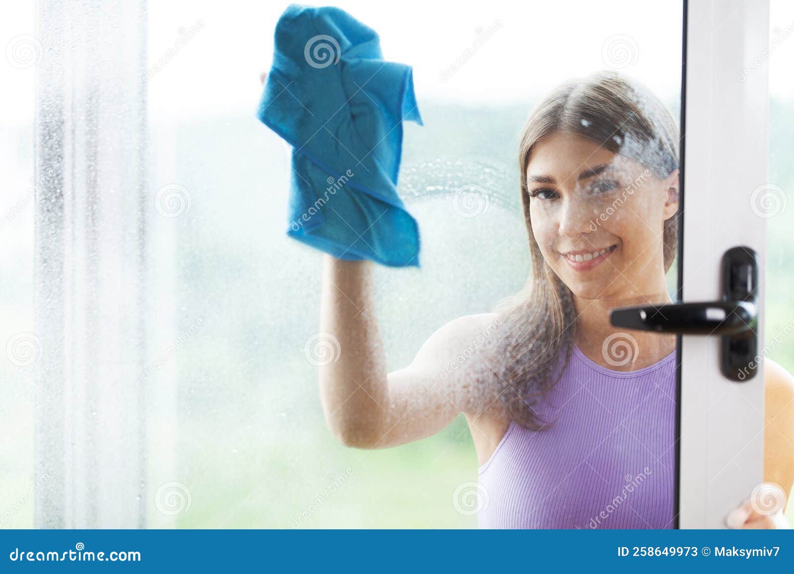 Young Smiling Woman Washing Window with Sponge. Stock Image - Image of ...