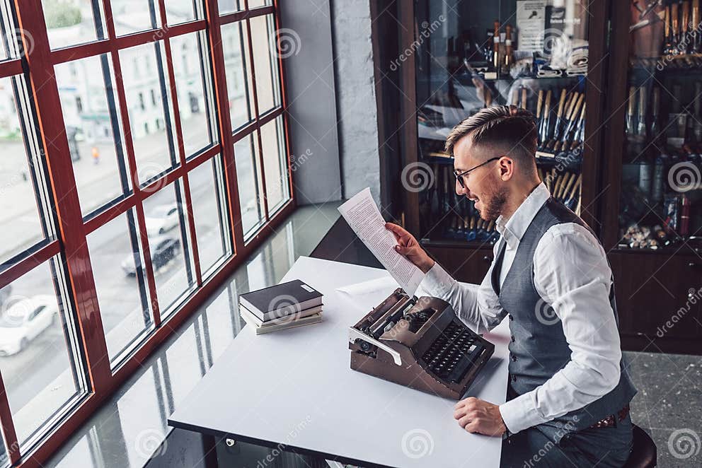 Young Smiling Writer in the Office Stock Image - Image of paper, window ...