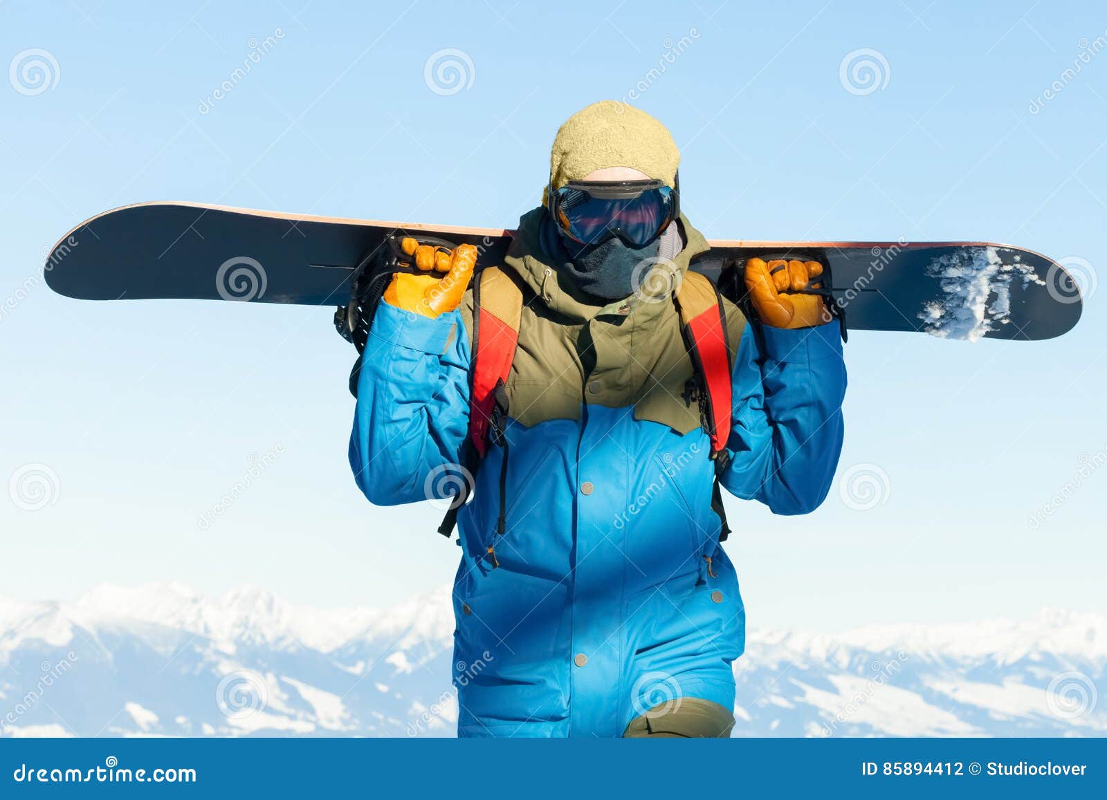Young Snowboarder in Helmet Holding Snowboard Behind His Back Stock ...