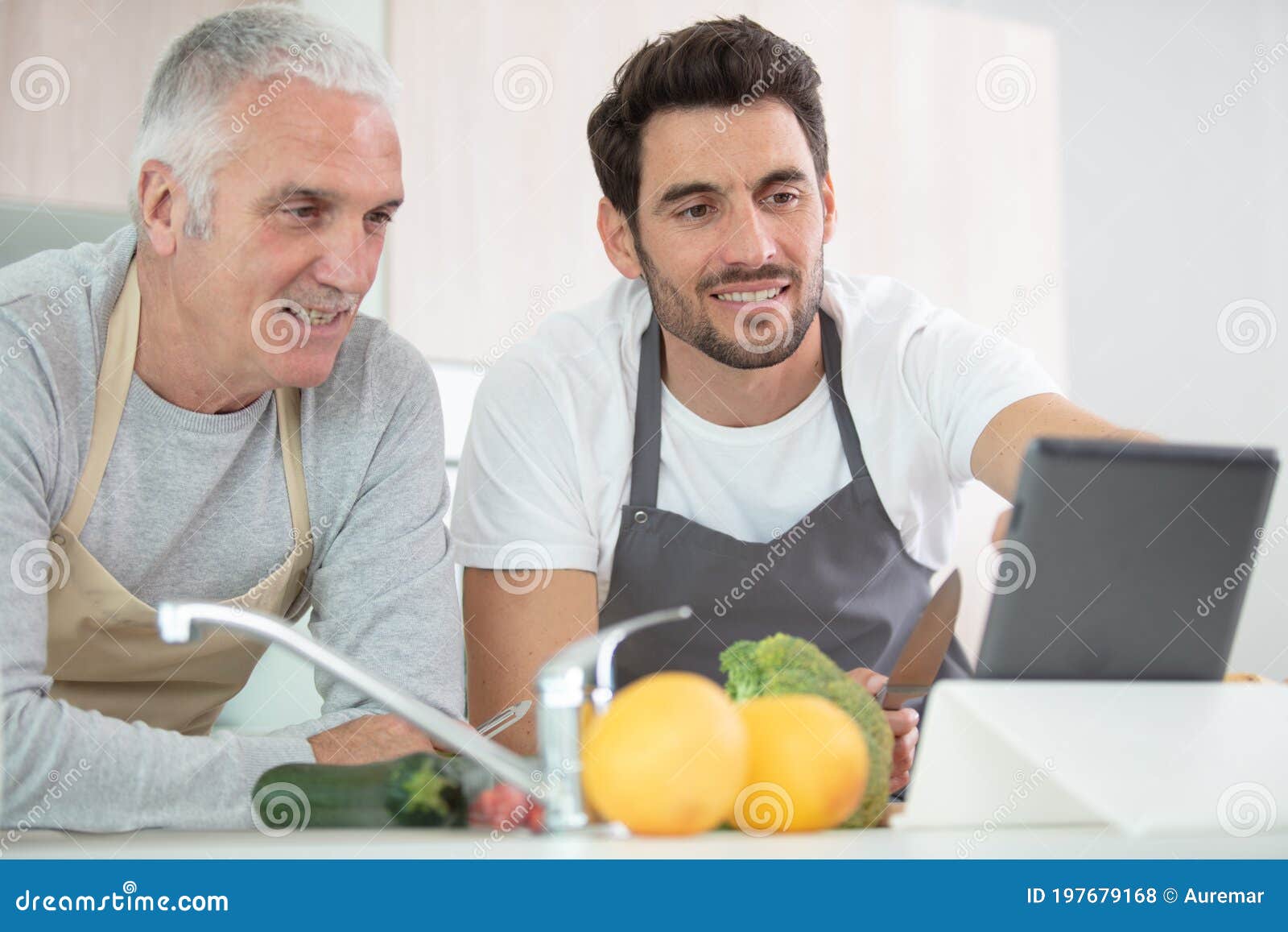 Father With Son Cooking Together In The Kitchen Stock Image ...