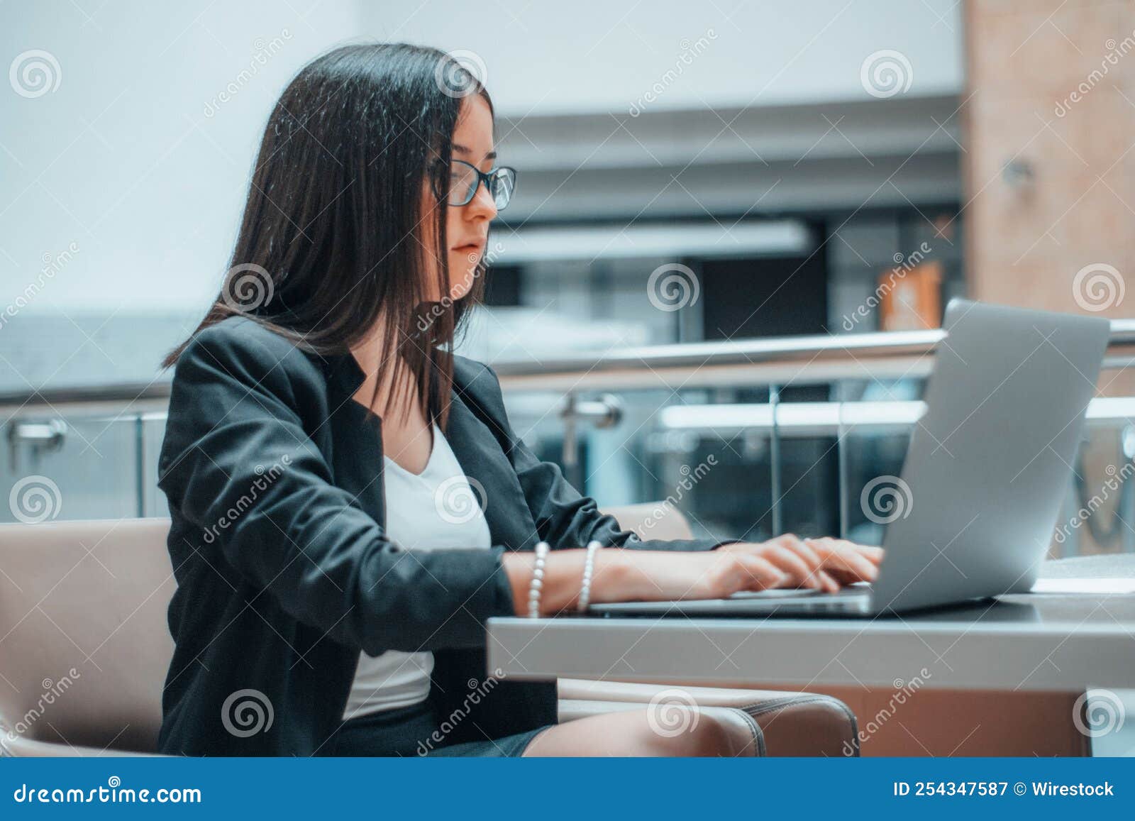 Young Spanish Woman Working on a Laptop Stock Image - Image of laptop ...