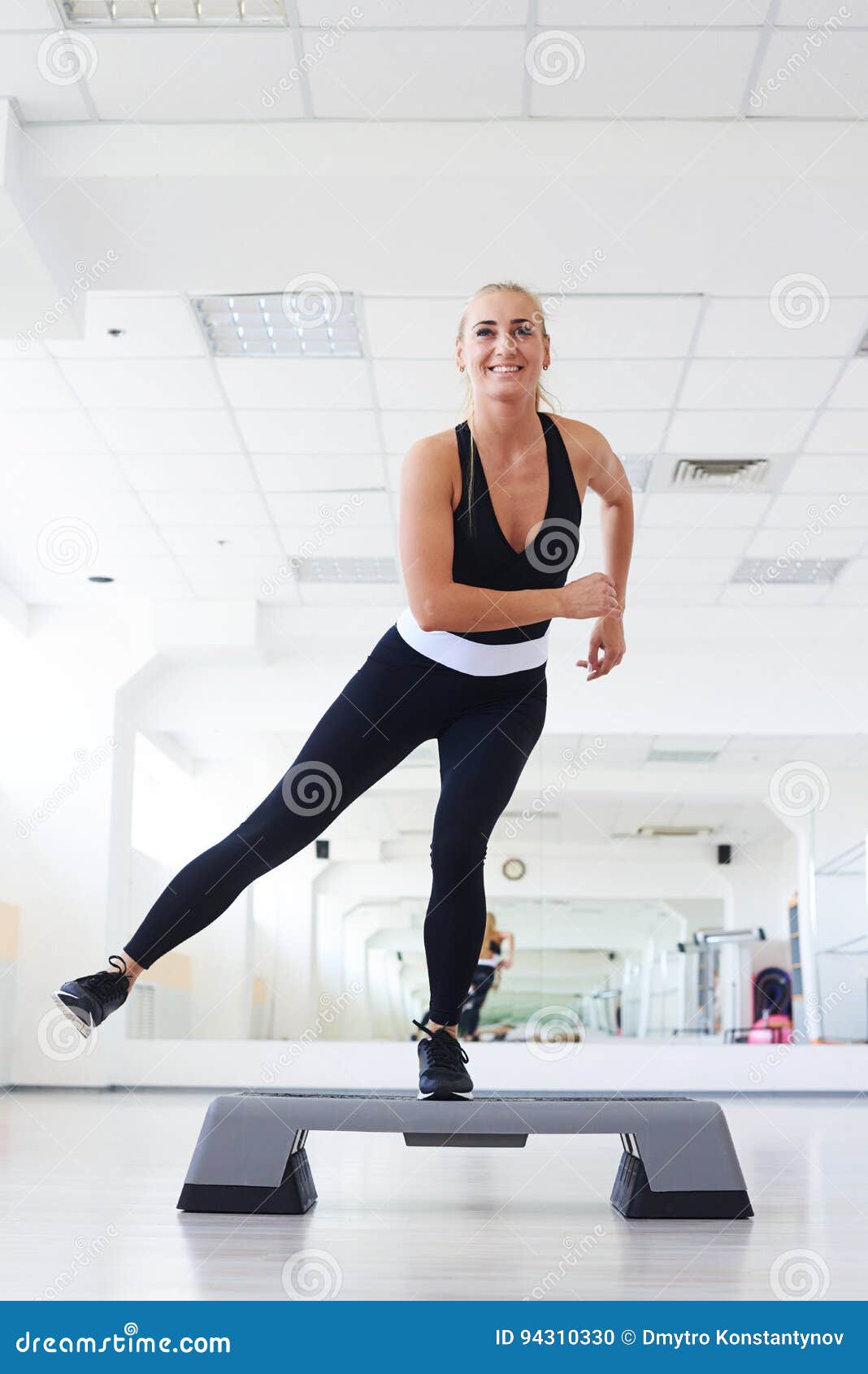 Young Sportive Woman Exercising in Gym Using Step Platform Stock Photo ...
