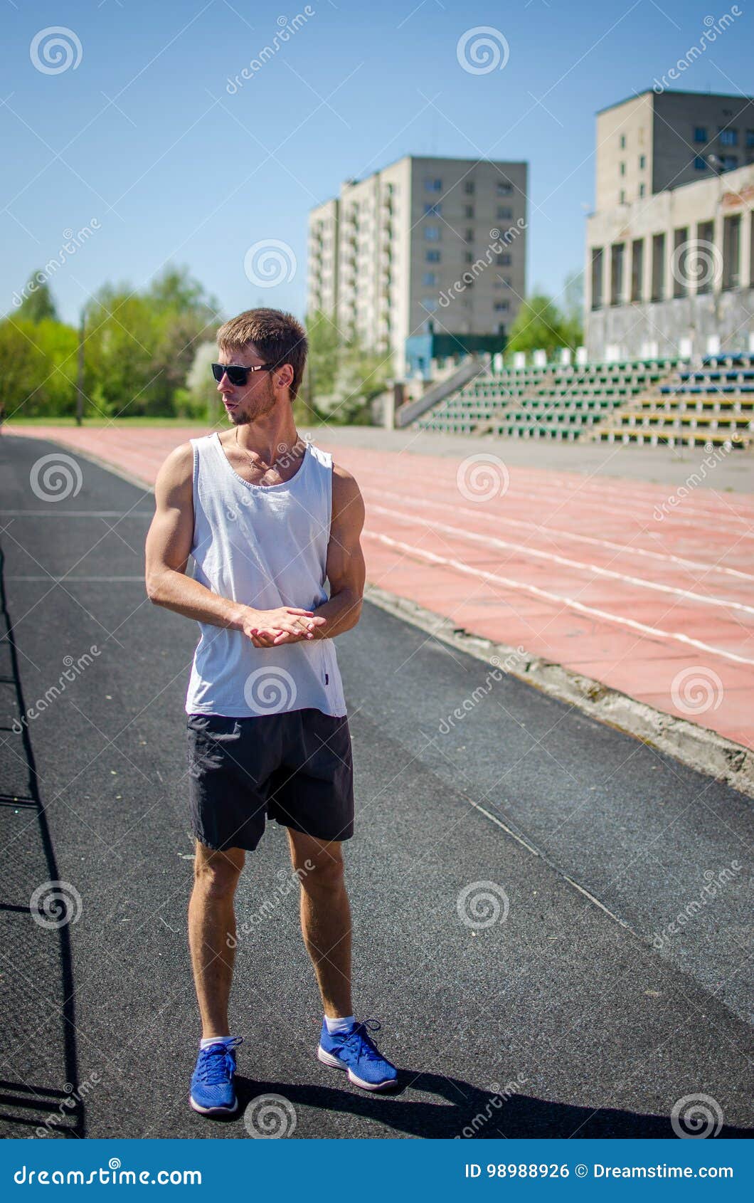 Guy stands at the stadium stock photo. Image of model - 98988926