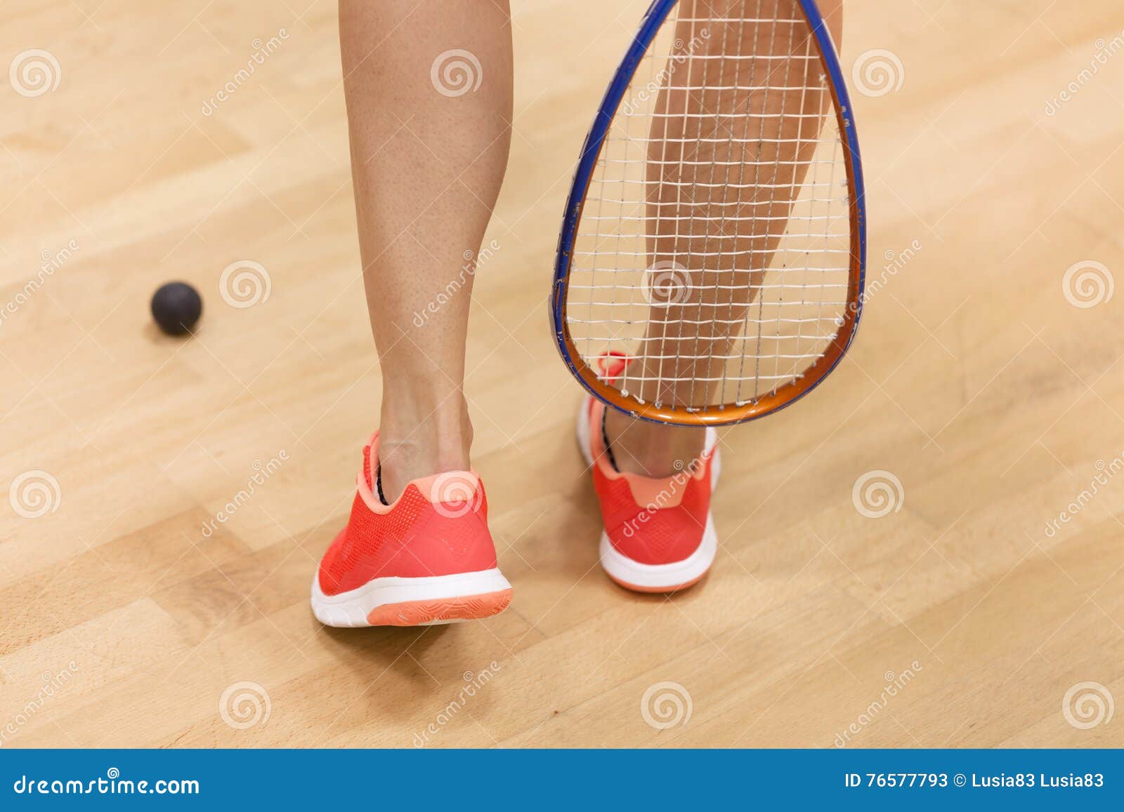 A Young Squash Player Hiting a Ball in a Squash Court Stock Image ...