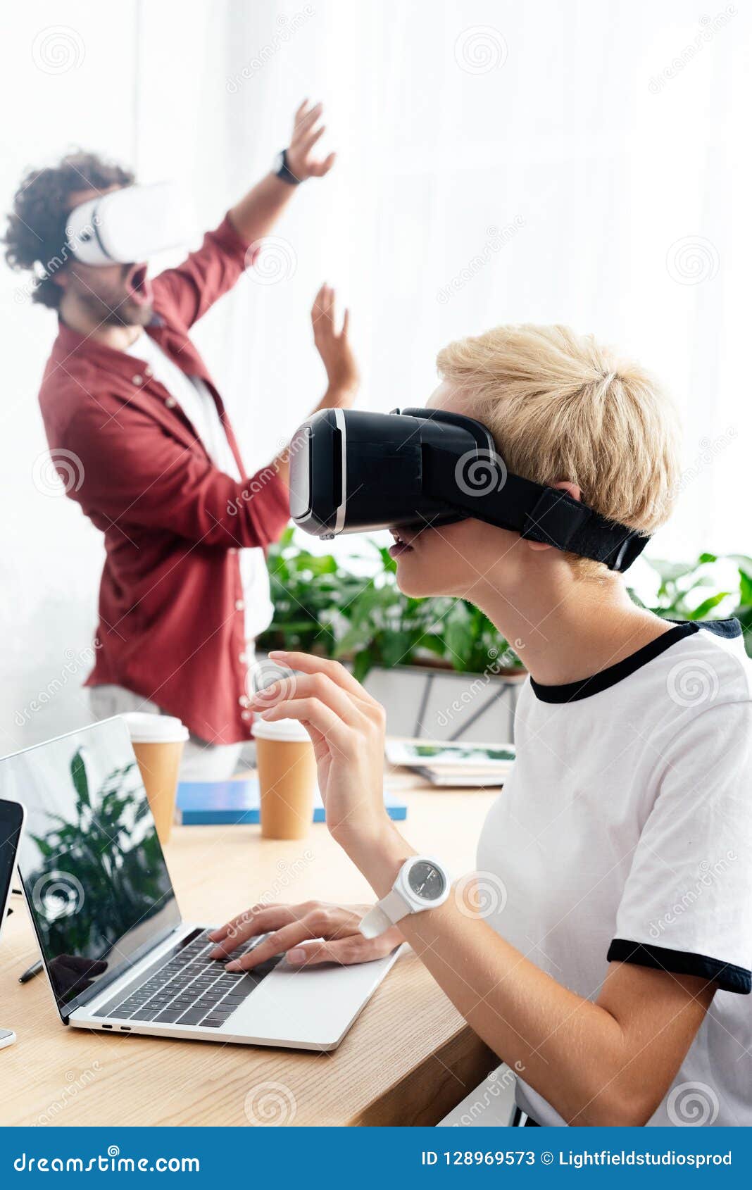 Young Start Up Team Using Virtual Reality Headsets and Working Stock ...