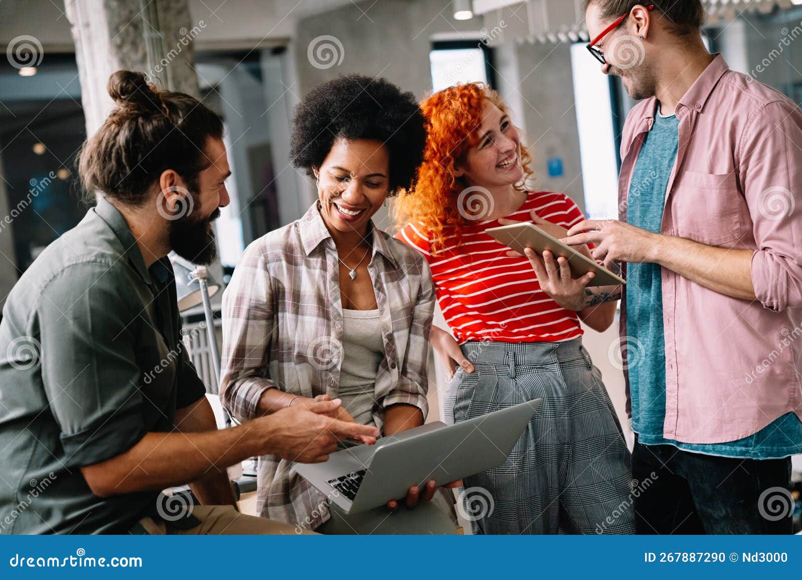 Young Startup Business People Having Fun, Working and Chatting at ...