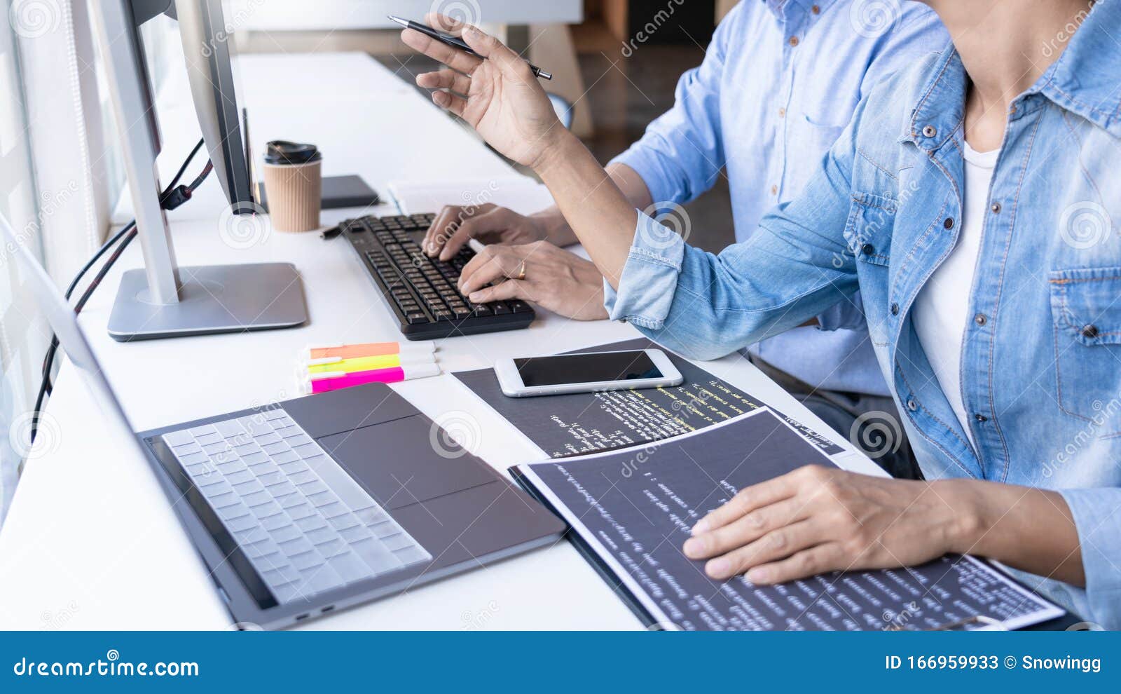 Young Startup Programmers Sitting at Desks Working on Computers Screen ...