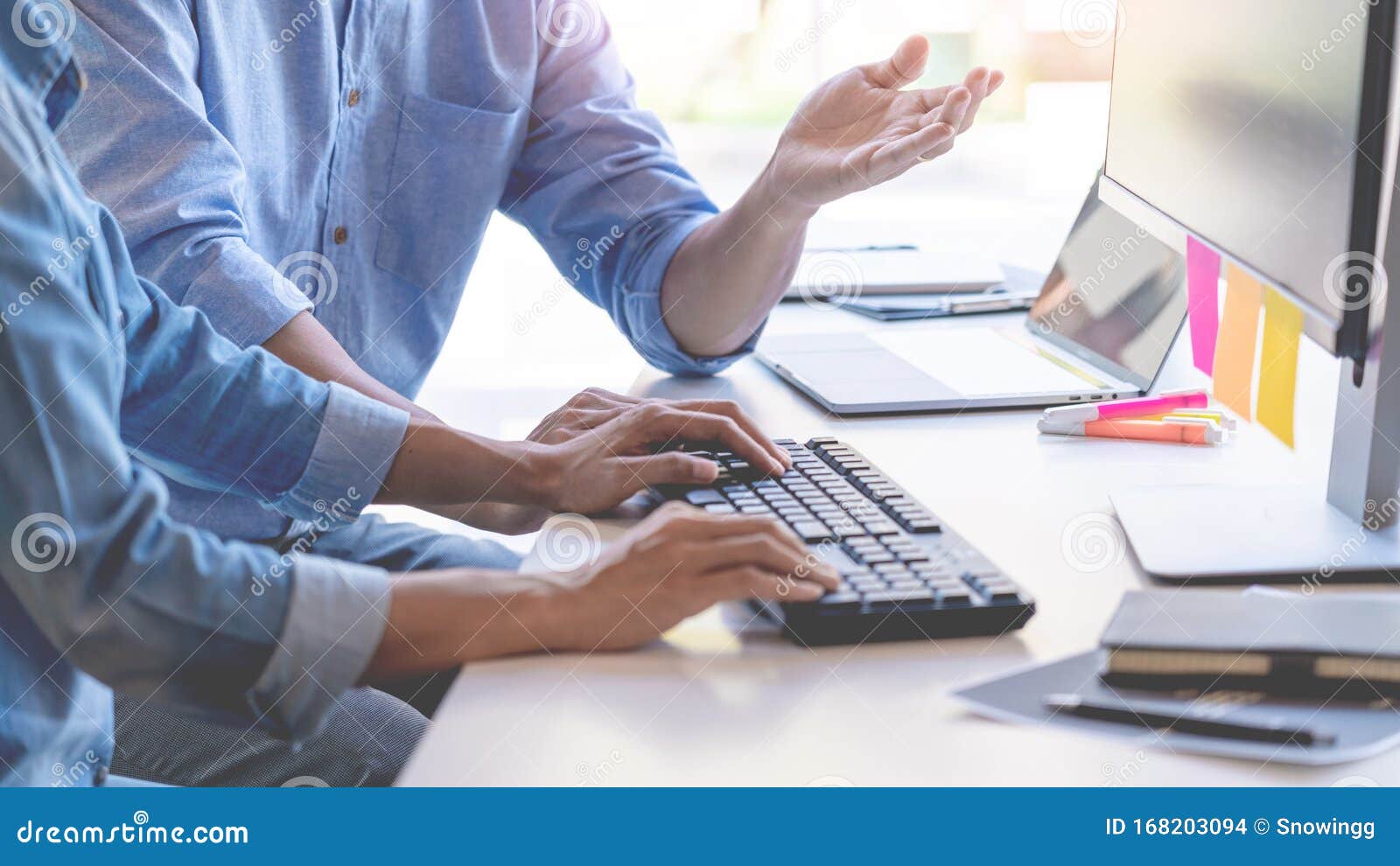 Young Startup Programmers Sitting at Desks Working on Computers Screen ...