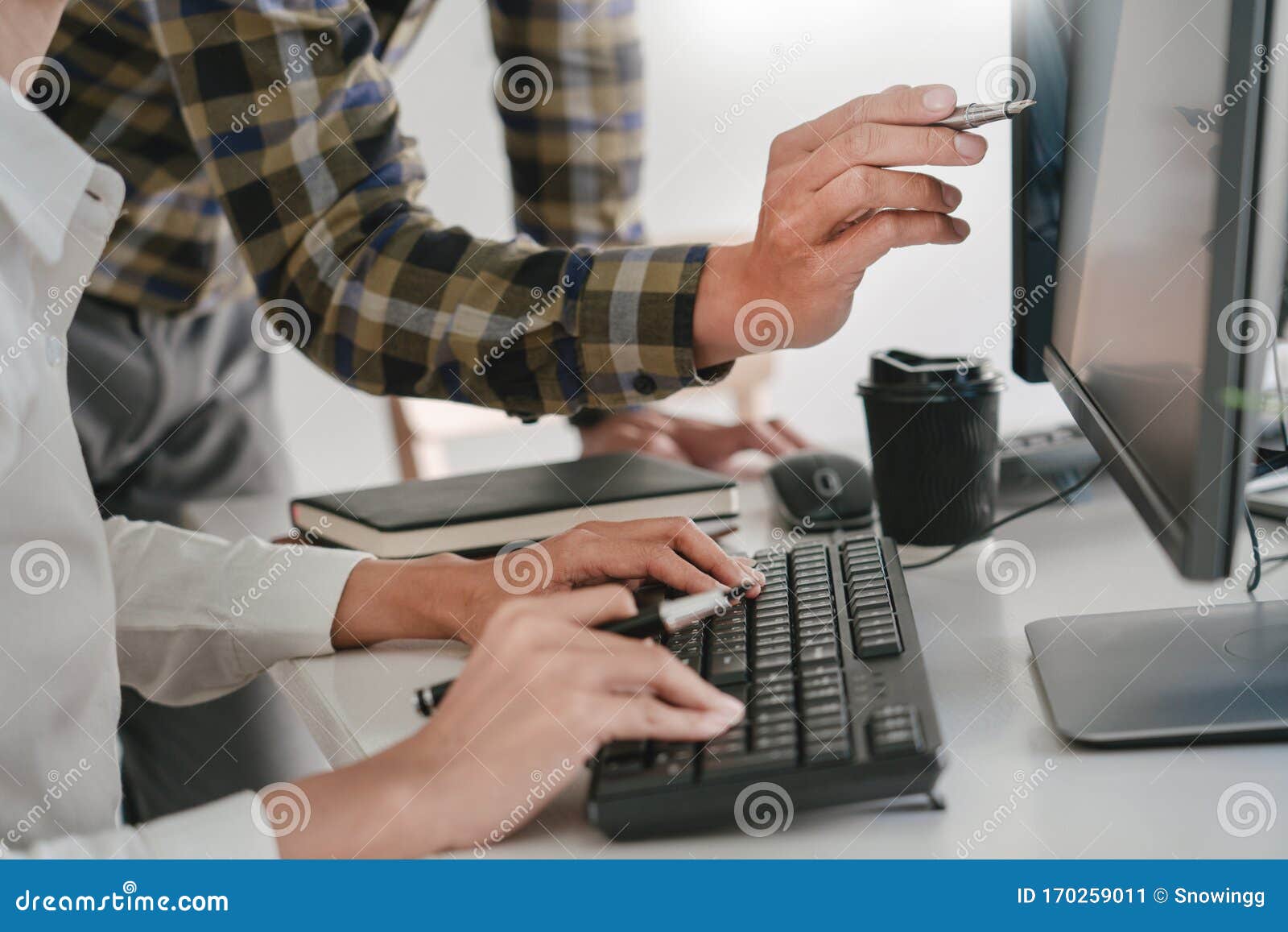 Young Startup Programmers Sitting at Desks Working on Computers Screen ...