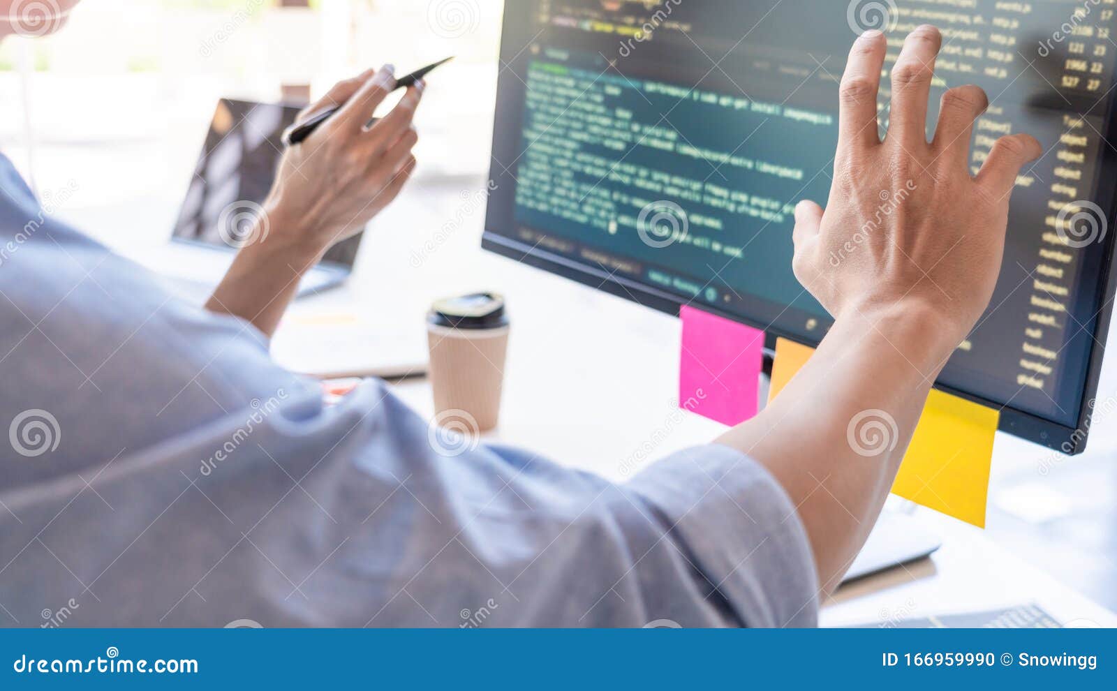 Young Startup Programmers Sitting at Desks Working on Computers Screen ...