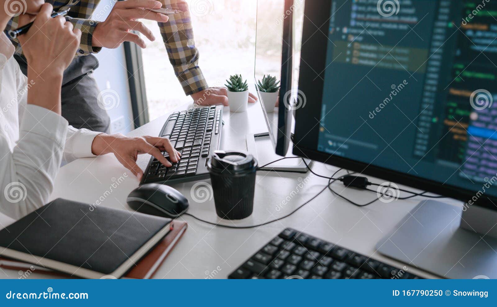 Young Startup Programmers Sitting at Desks Working on Computers Screen ...