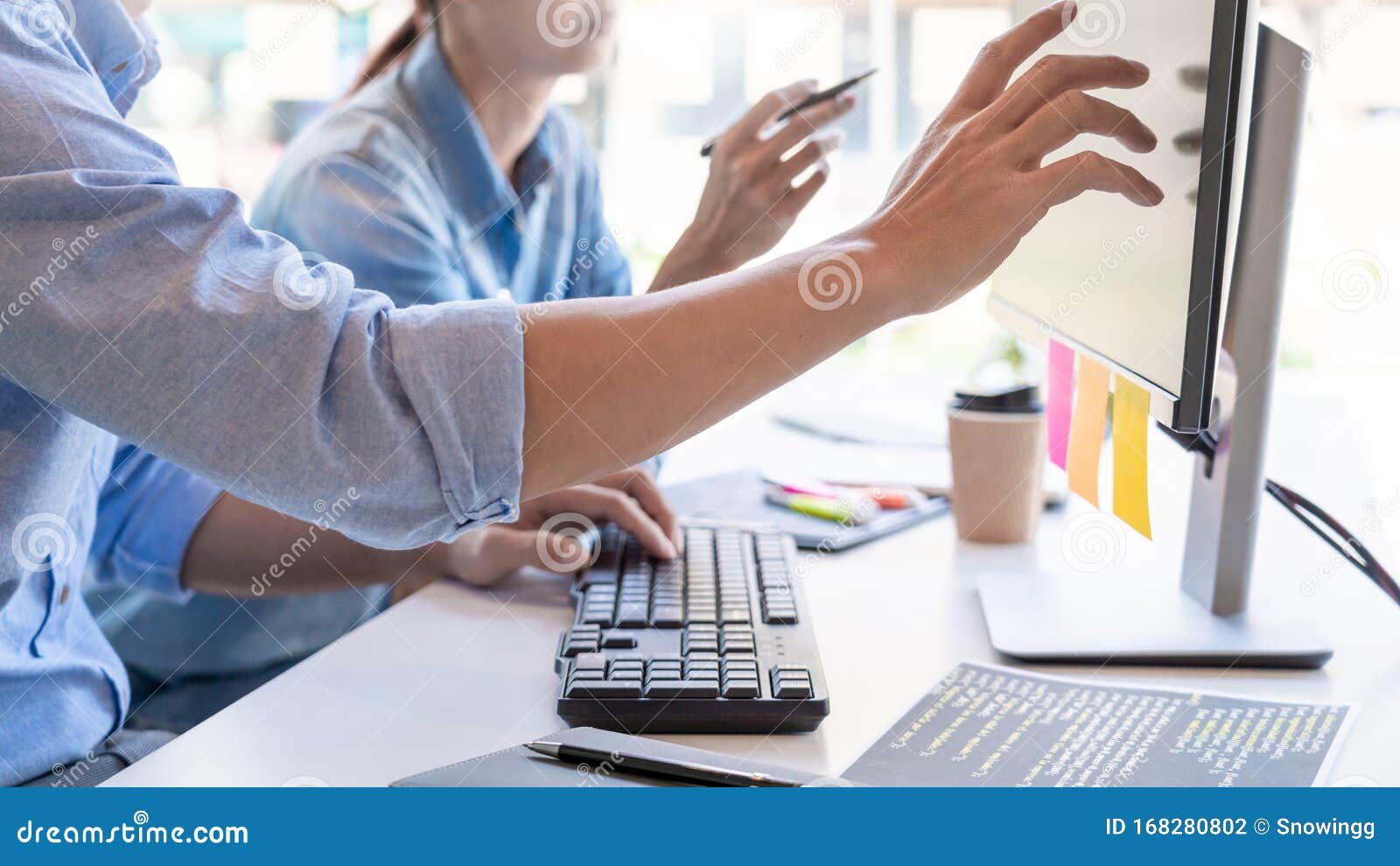 Young Startup Programmers Sitting at Desks Working on Computers Screen ...
