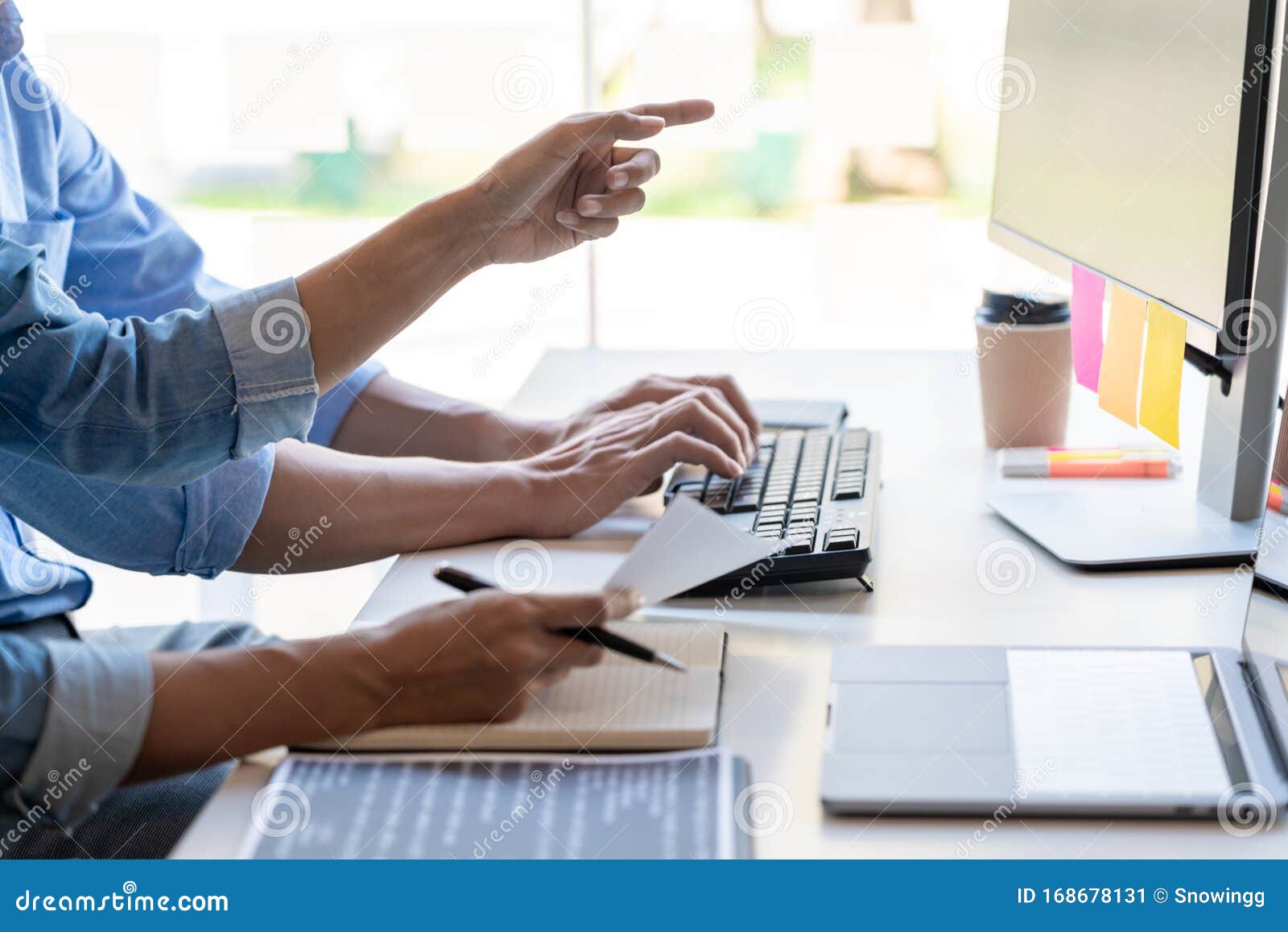 Young Startup Programmers Sitting at Desks Working on Computers Screen ...
