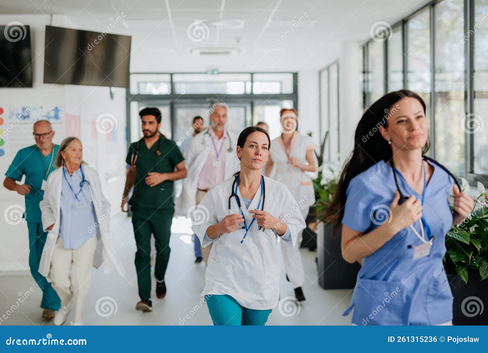 Young Stressed Doctors Running at Hospital Corridor. Stock Photo ...