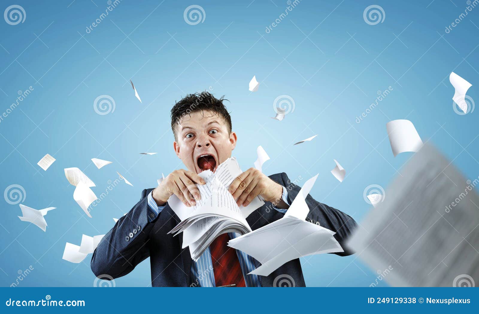 Young Stressed Man Ripping Documents with Frustrated Facial Expression ...