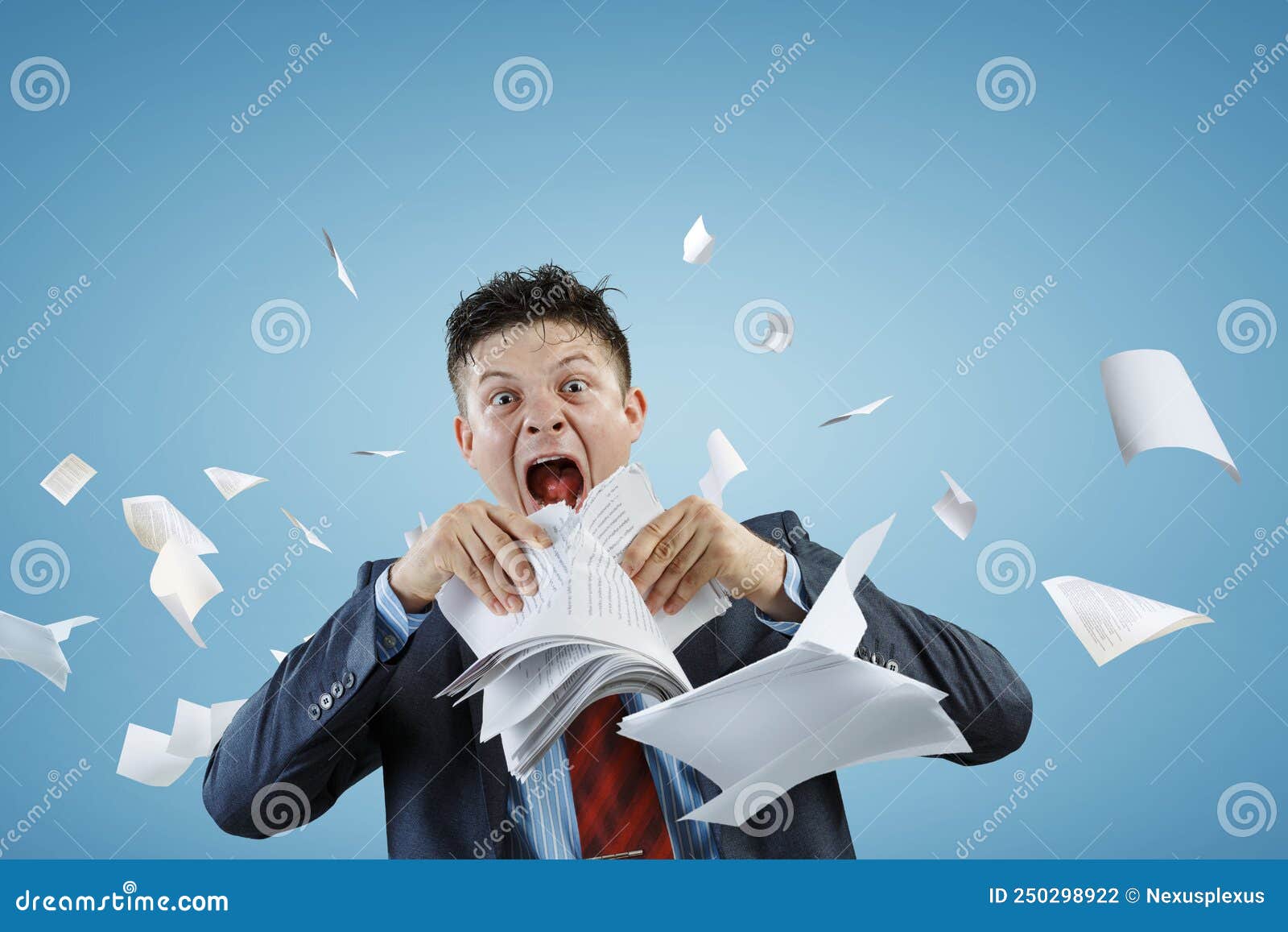 Young Stressed Man Ripping Documents with Frustrated Facial Expression ...