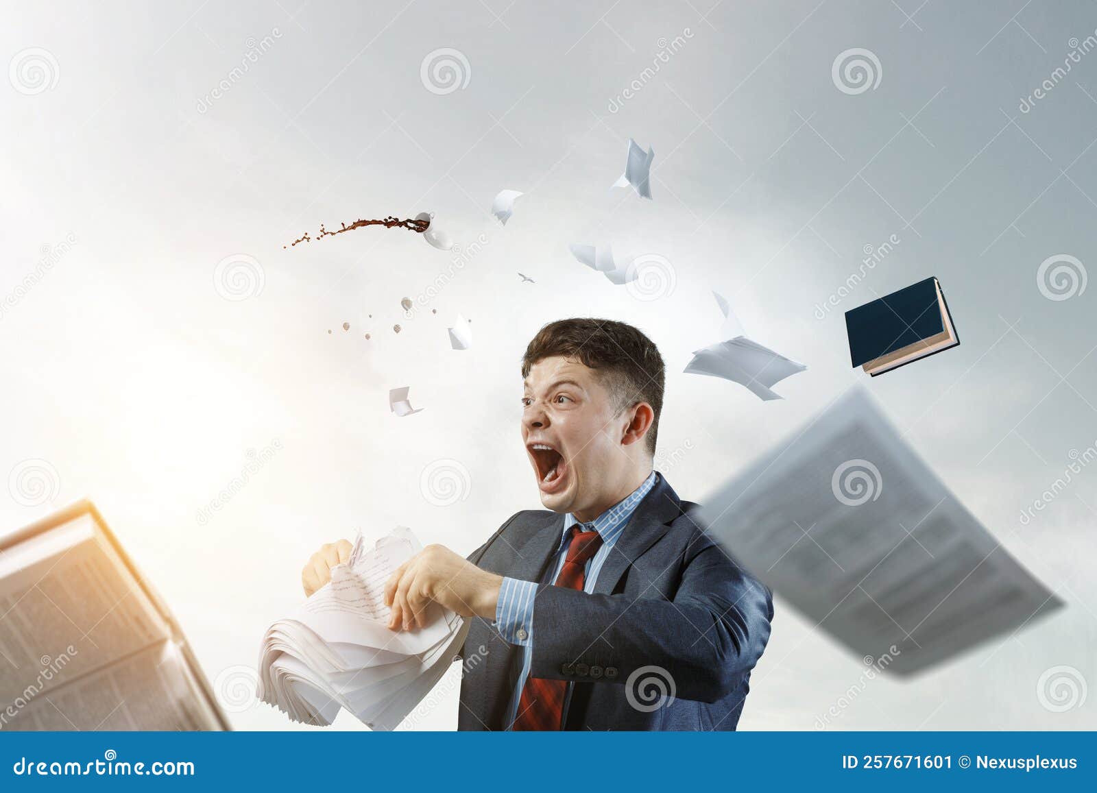 Young Stressed Man Ripping Documents with Frustrated Facial Expression ...