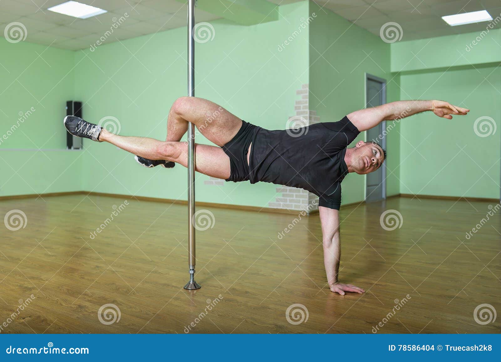 Young Strong Male Dancer Performing Dancing Moves on the Pole Stock ...