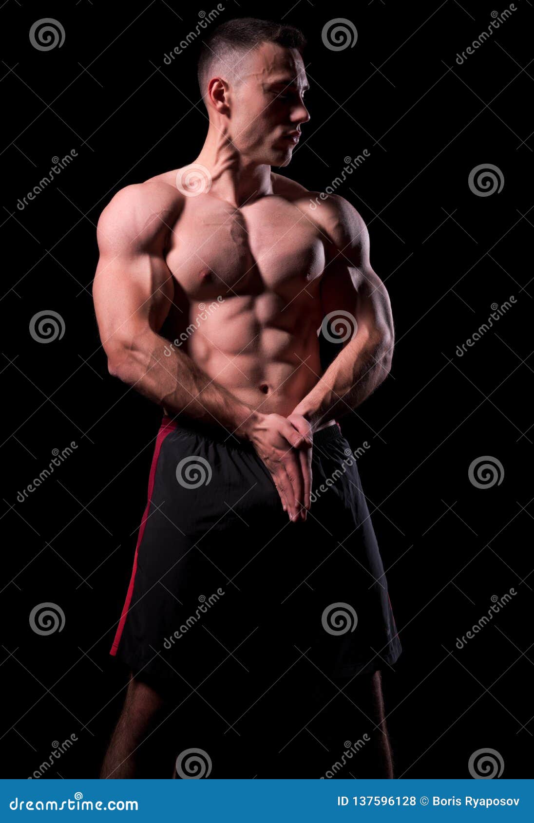Young strong man isolated stock photo. Image of biceps - 137596128