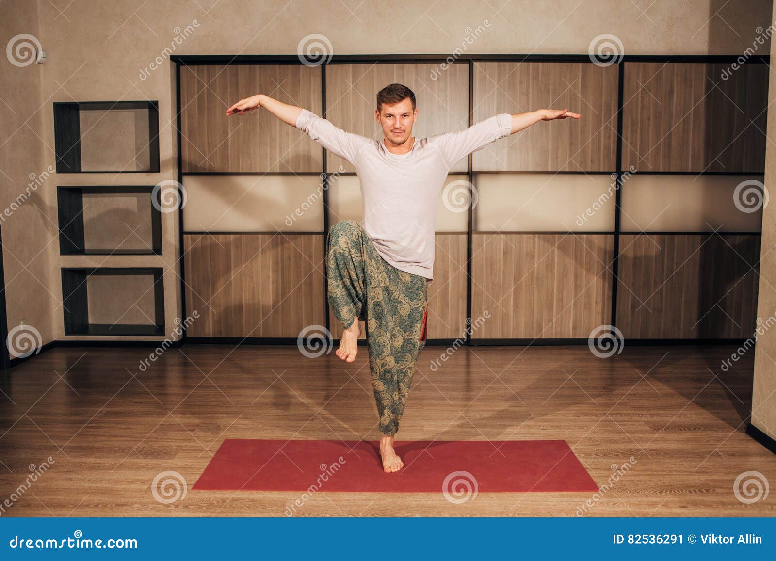 Young Strong Man in the Tree Pose Stock Image - Image of posing ...
