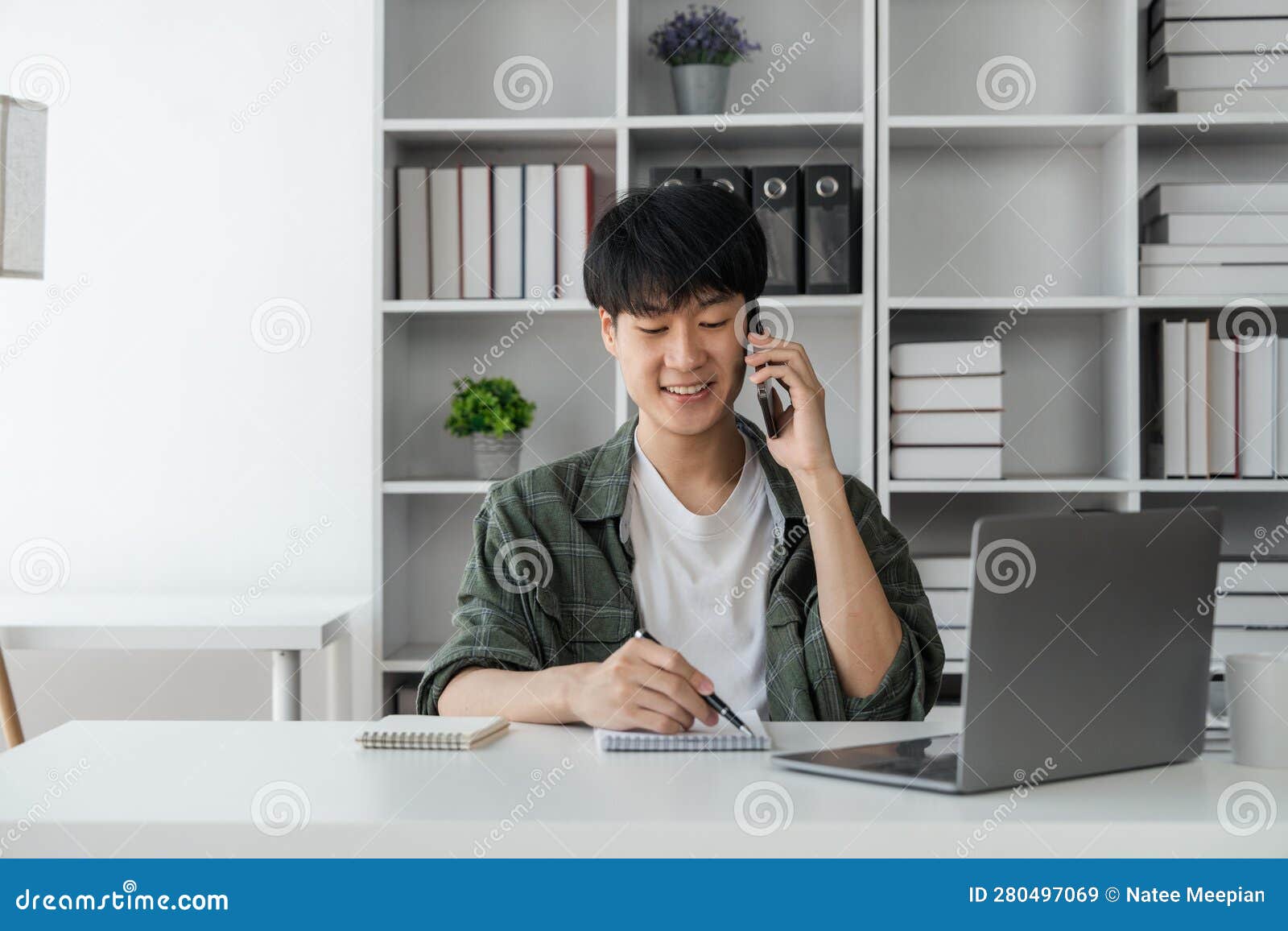 Young Student Busy Study Make Notes in Notebook and Using Laptop ...