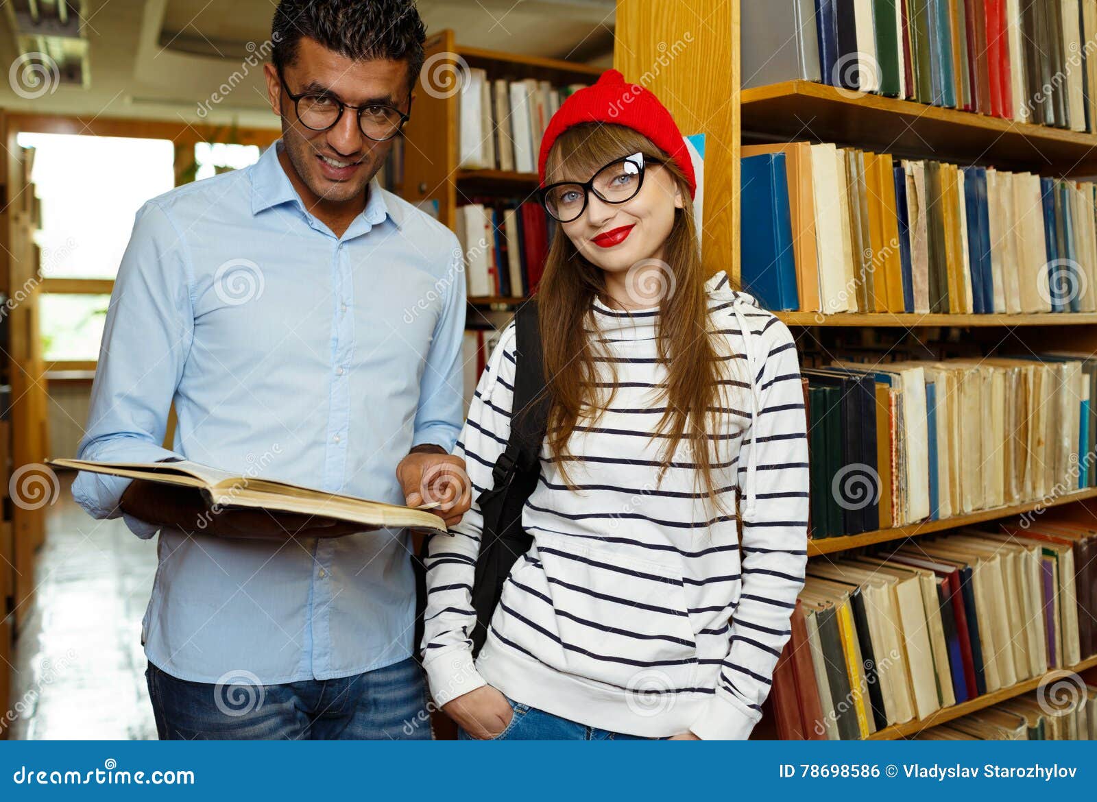 Young Student Couple Choosing Books in the Library Stock Photo - Image ...
