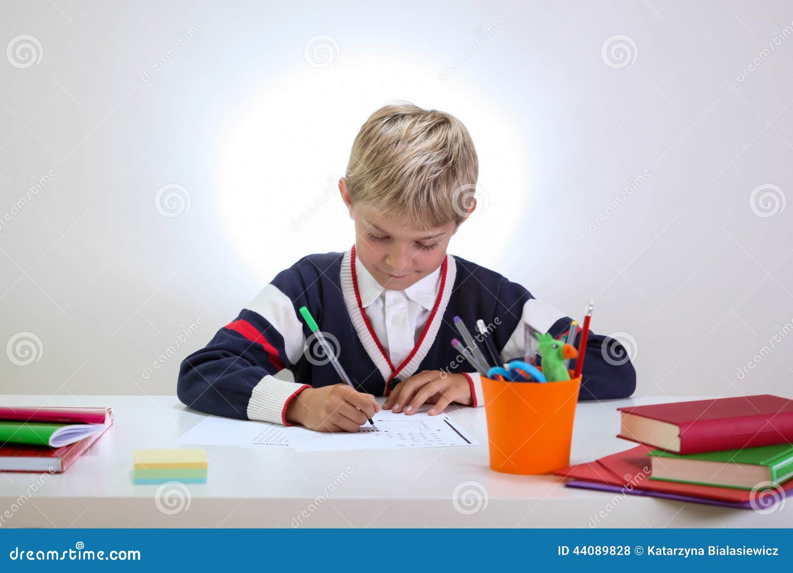 Young Student Doing His Homework Stock Photo - Image of exam, sitting ...