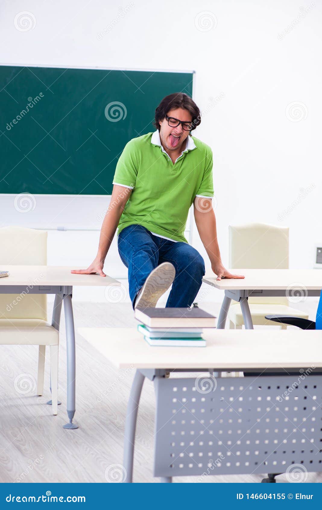 The Young Student Doing Physical Exercises in the Classroom Stock Image ...
