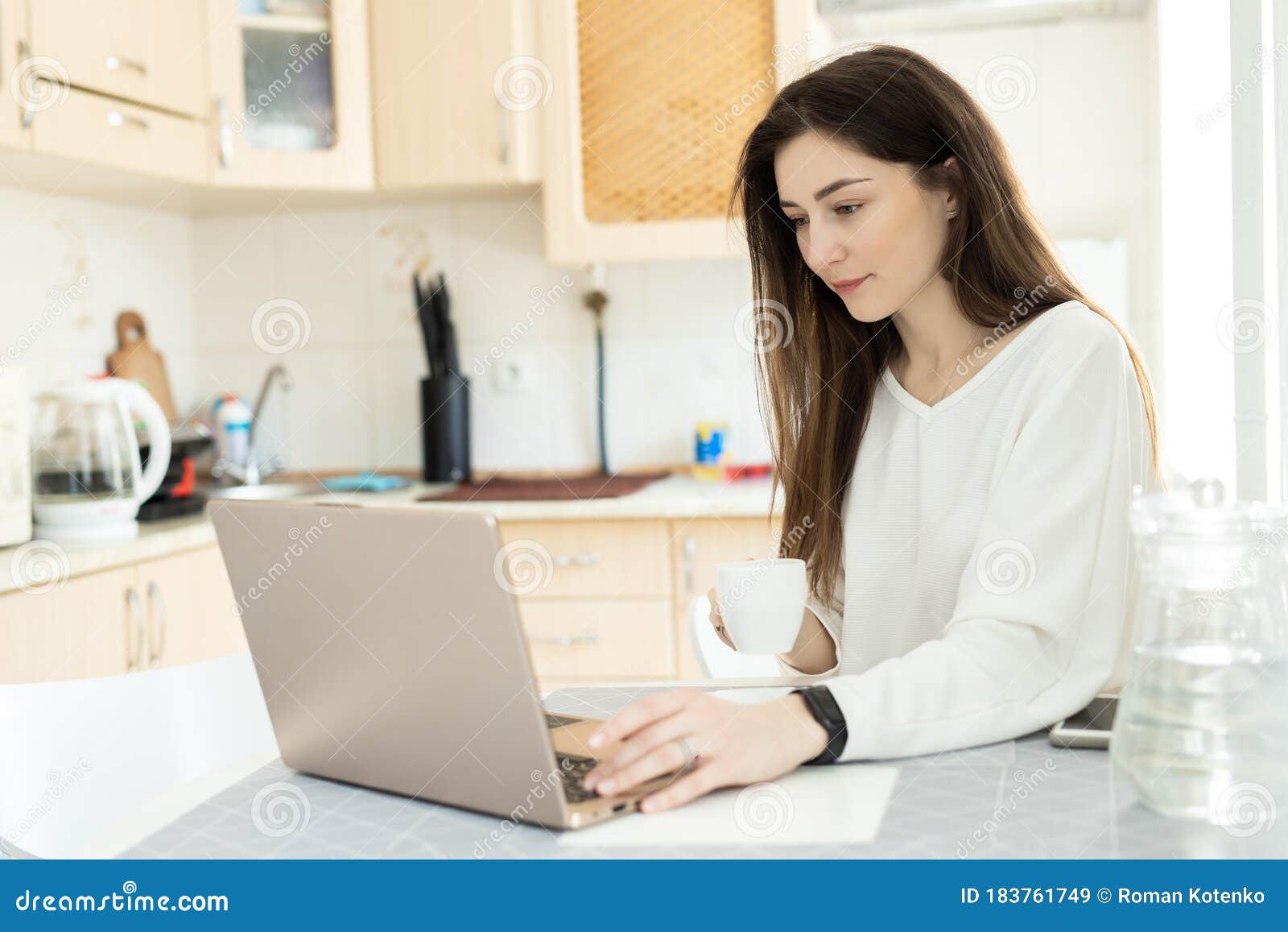 Young Student E-learning with Laptop and Drink Coffee in Kitchen at ...
