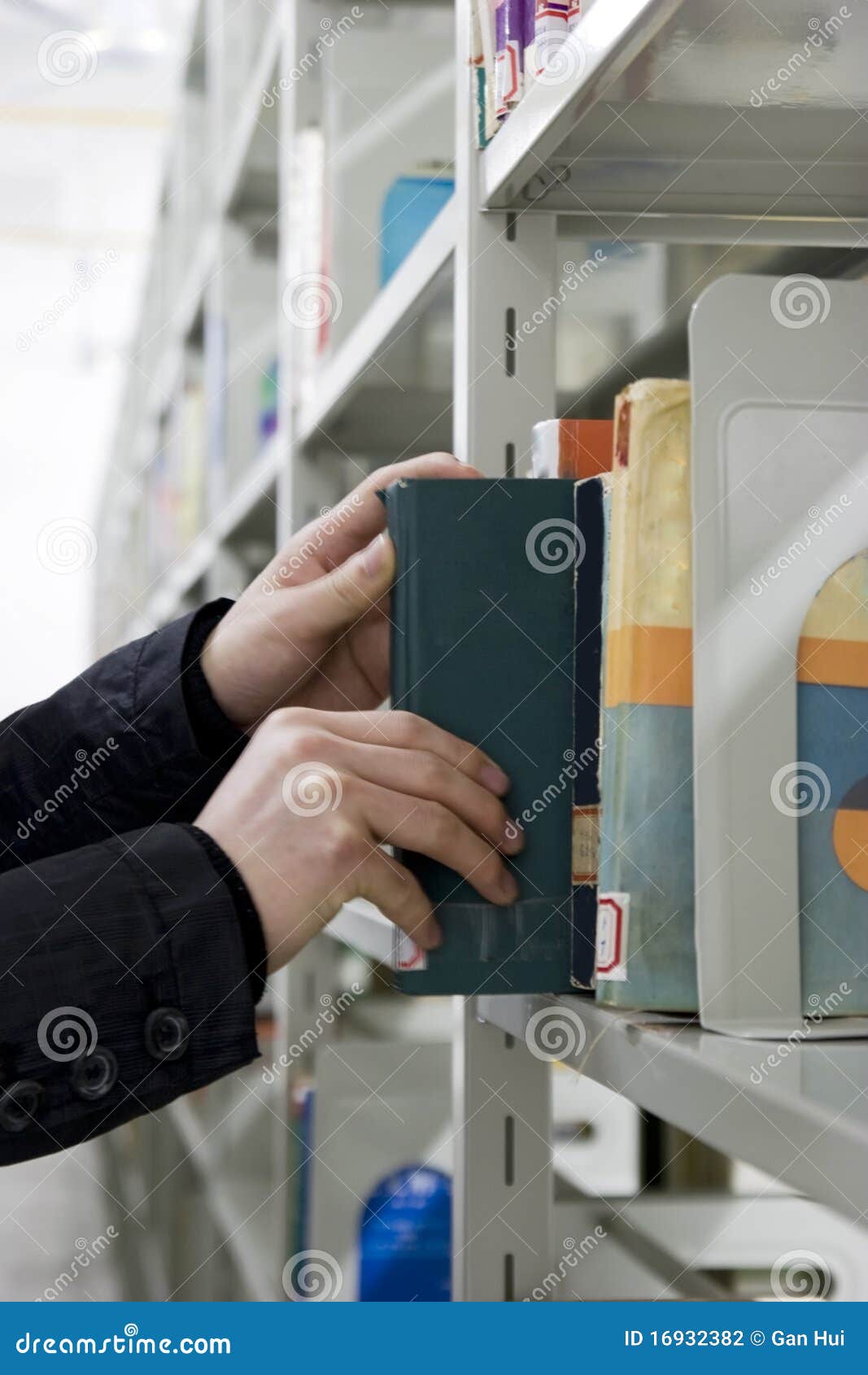 Young Student Finds Books in Library Stock Photo - Image of people ...