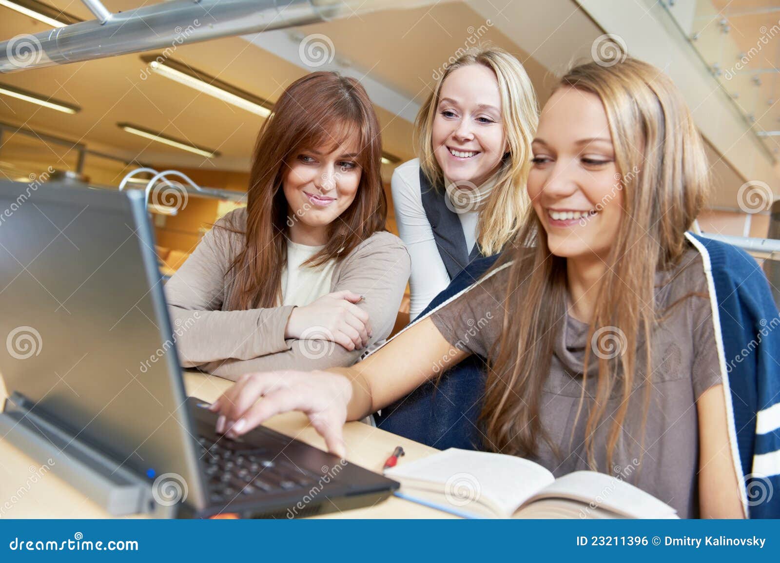Young Student Girls Working with Laptop in Library Stock Photo - Image ...