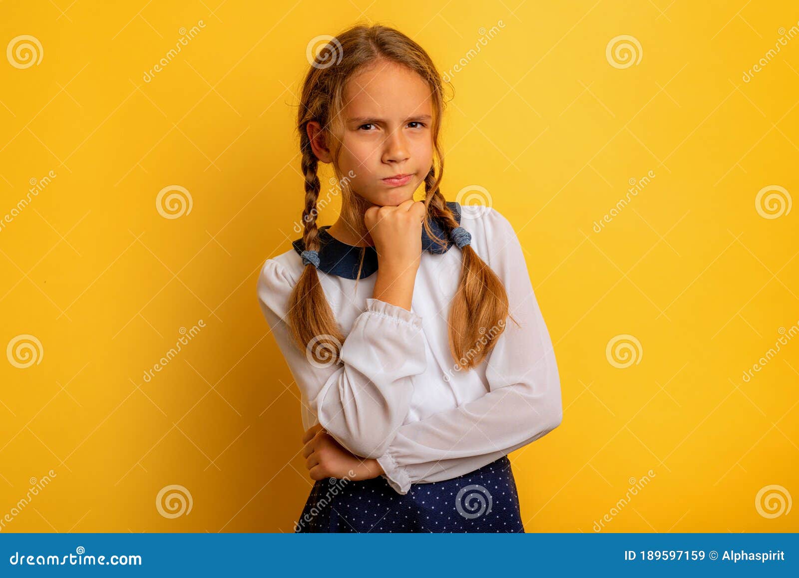 Young Student Has Some Doubt about Something. Yellow Background Stock ...