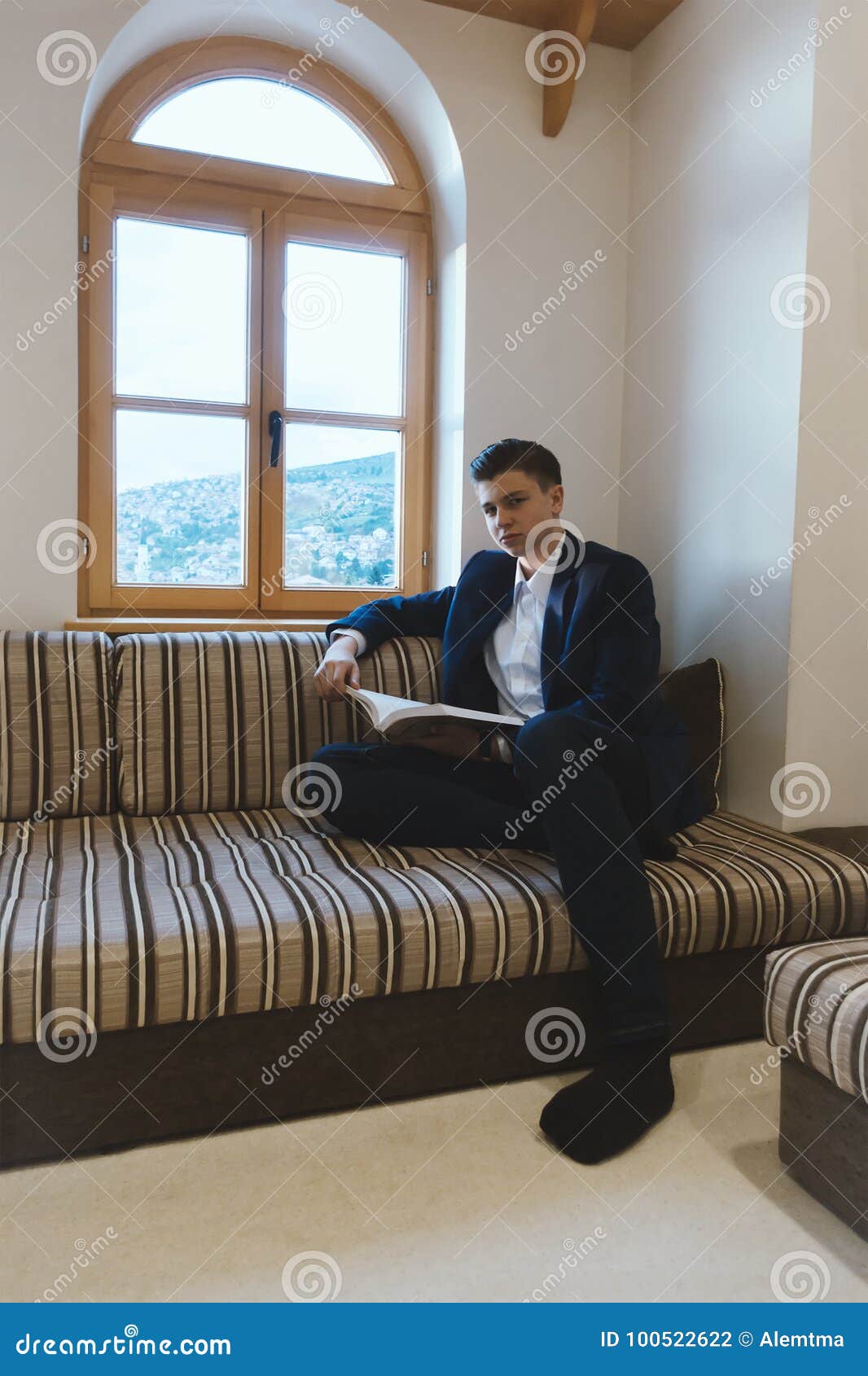 Young Student Learning in Front of Bright Window Stock Photo - Image of ...