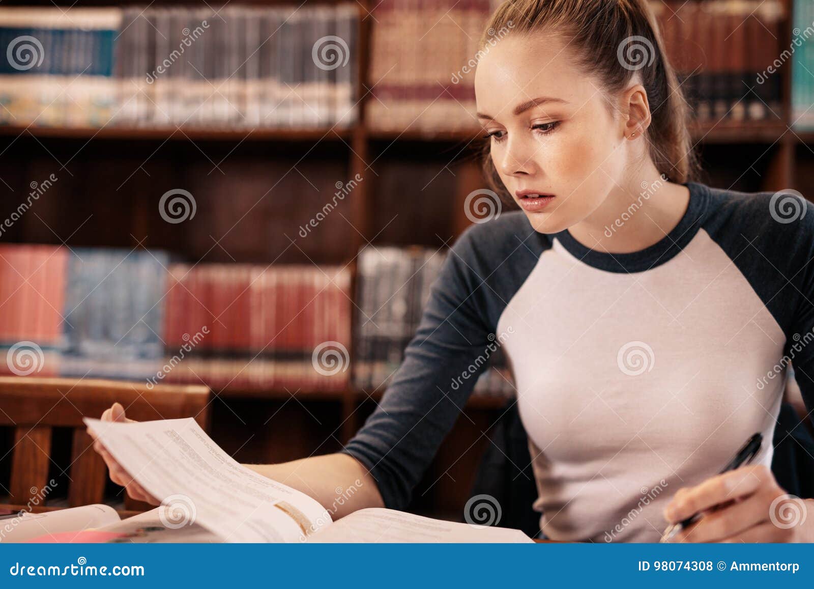Young Student Learning Book in Library Stock Photo - Image of high ...