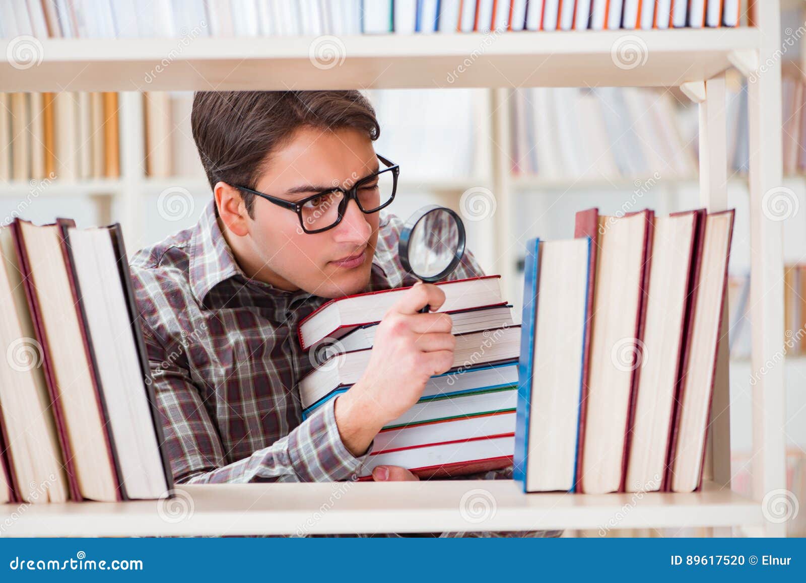 The Young Student Looking for Books in College Library Stock Photo ...