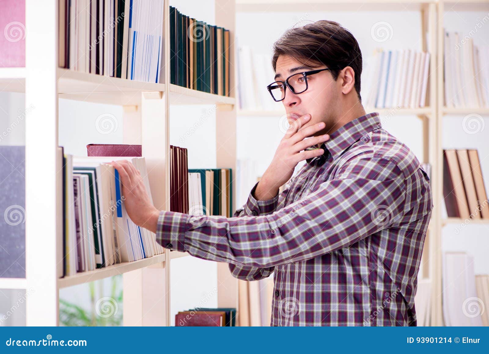 The Young Student Looking for Books in College Library Stock Photo ...