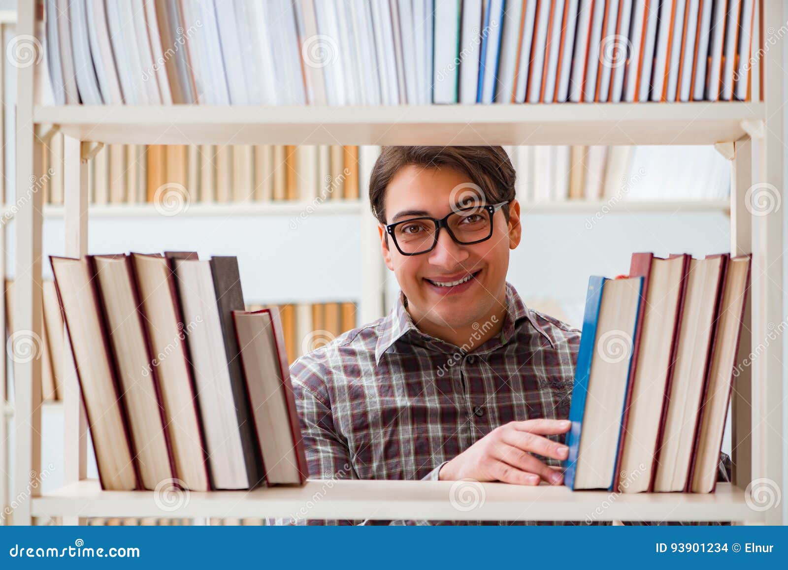 The Young Student Looking for Books in College Library Stock Photo ...
