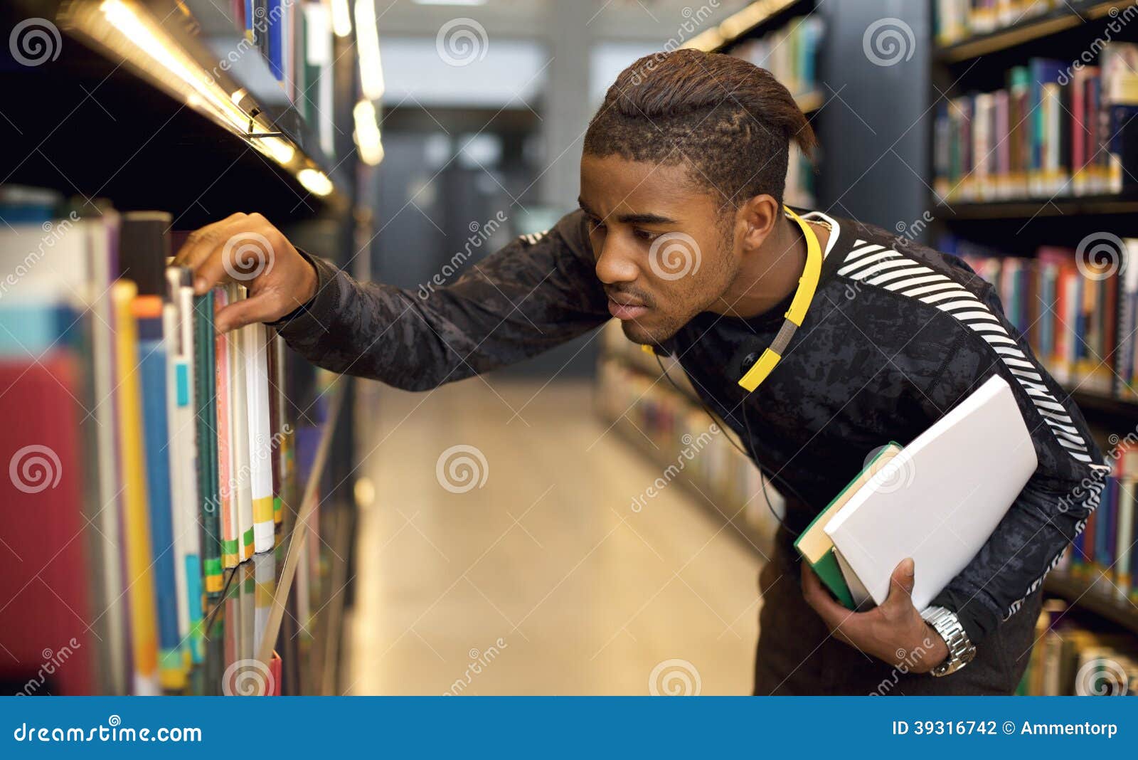 Young Student Looking for Books at Library Stock Photo - Image of ...