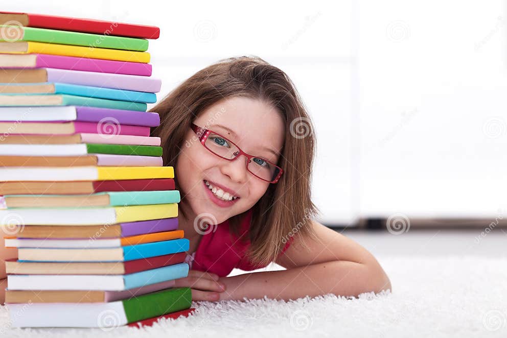 Young Student with Lots of Books Smiling Stock Image - Image of pile ...
