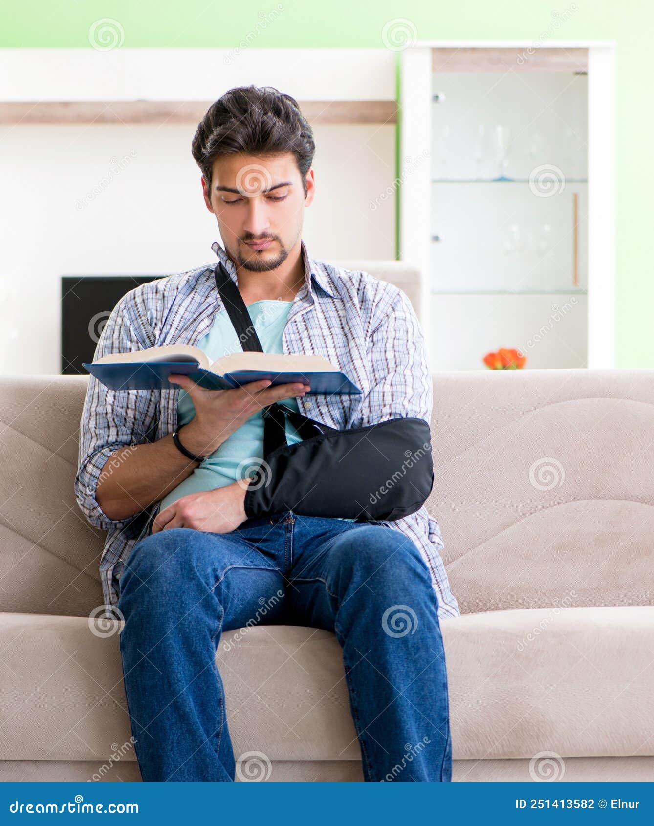 Young Student Man with Hand Injury Sitting on the Sofa Stock Photo ...