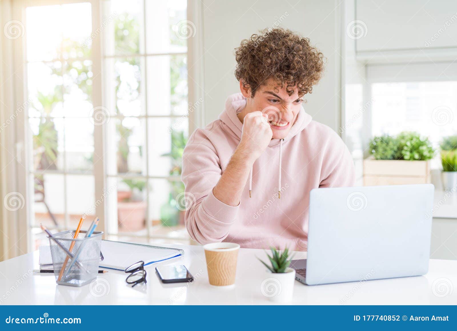 Young Student Man Working and Studying Using Computer Laptop Annoyed ...