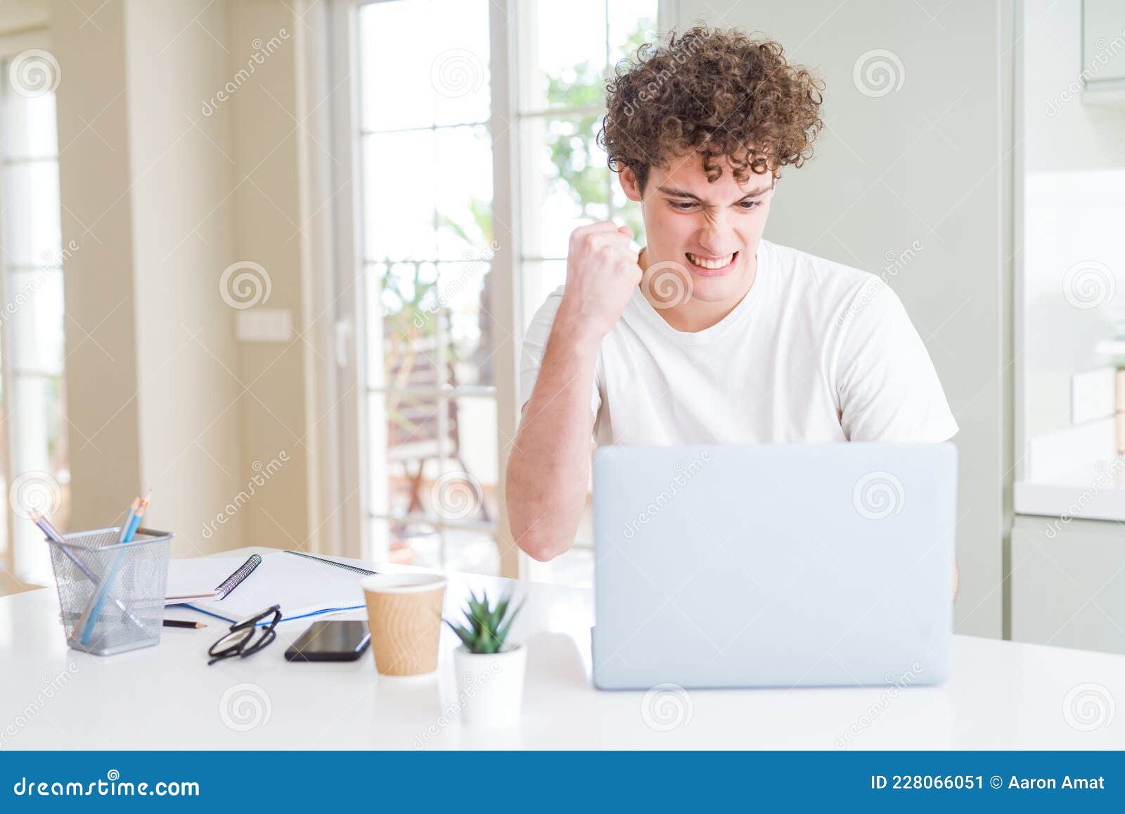 Young Student Man Working and Studying Using Computer Laptop Annoyed ...
